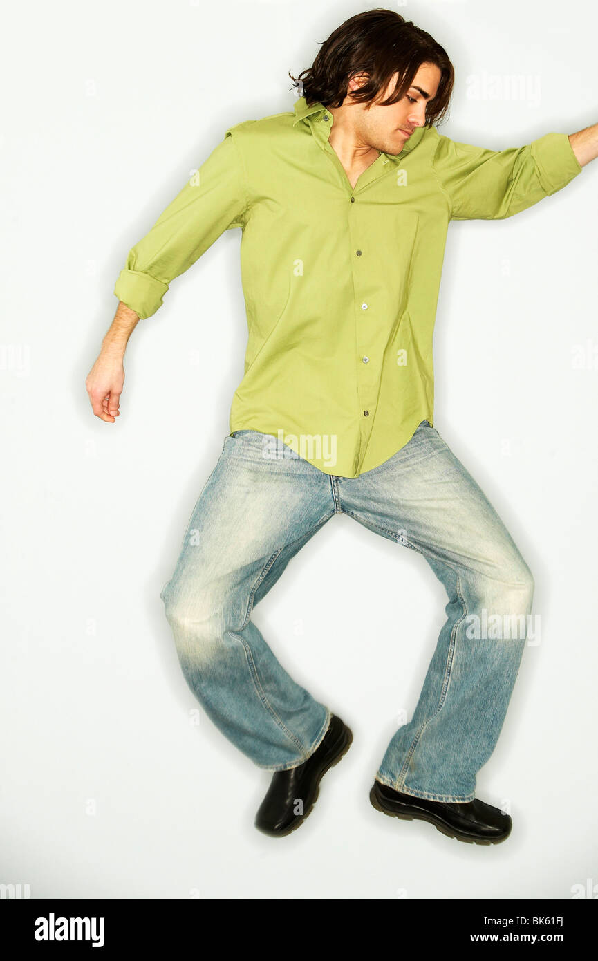 Young man jumping Stock Photo - Alamy