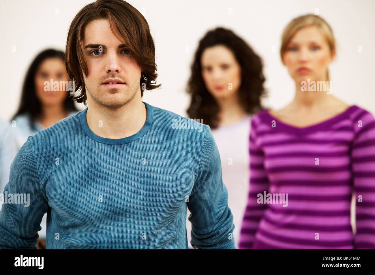 Portrait of a young man with his friends Stock Photo - Alamy