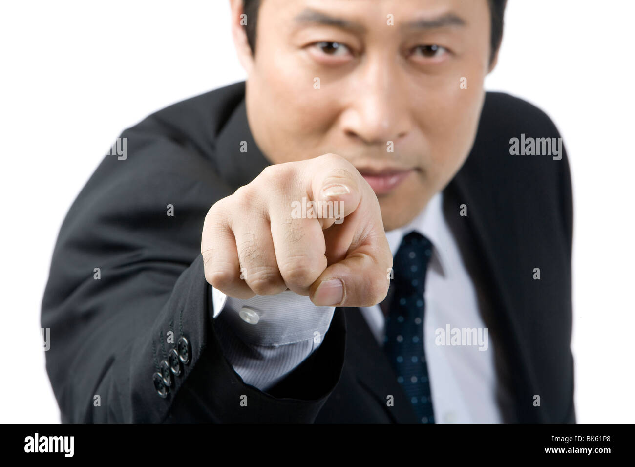Businessman pointing the front by finger Stock Photo - Alamy
