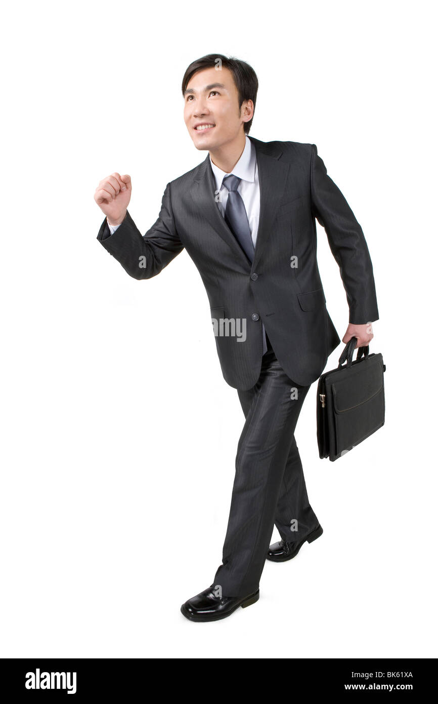 Businessman on the move Stock Photo - Alamy