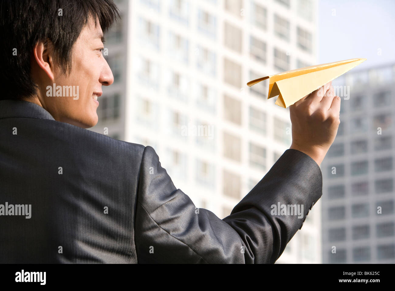 Chinese businessman throwing paper hi-res stock photography and images ...