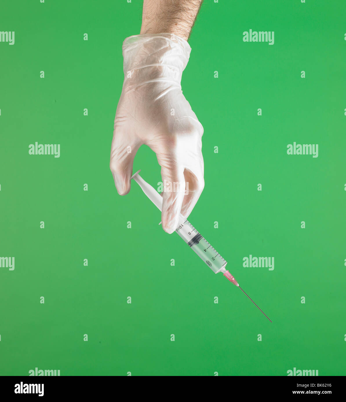 liquid filled syringe and medical gloved hand Stock Photo - Alamy