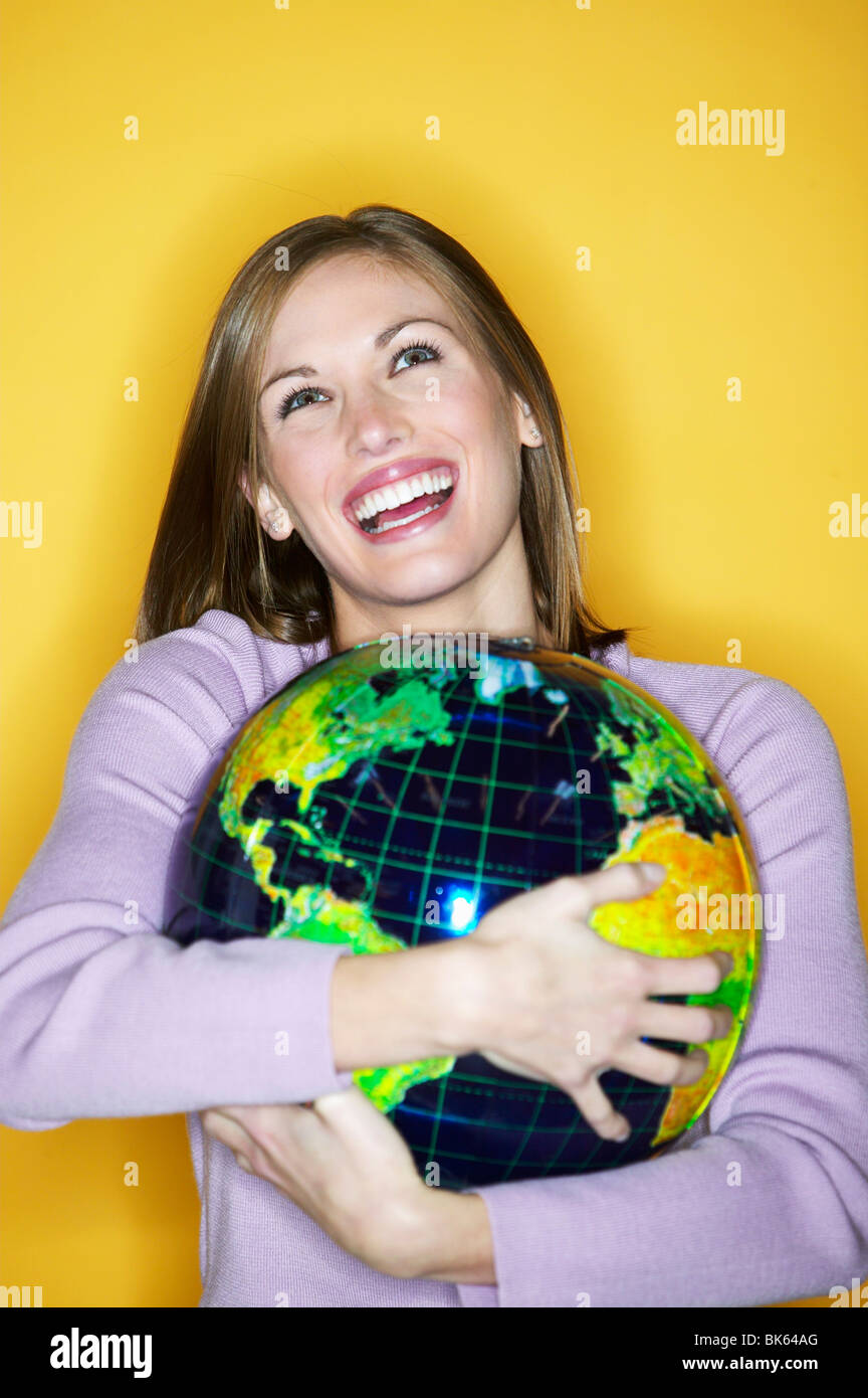 Holding hugging globe hi-res stock photography and images - Alamy