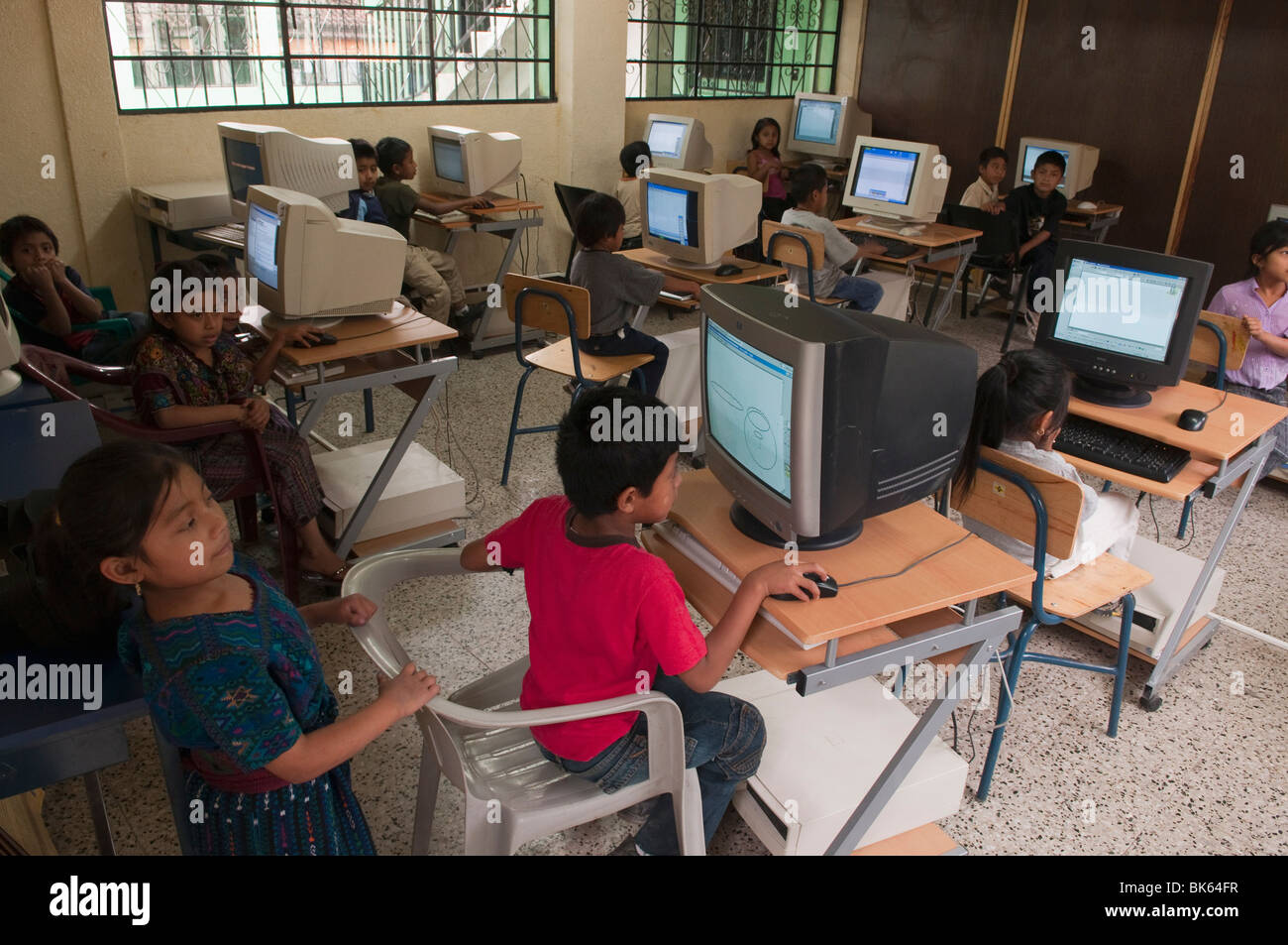 Primary school children working computers hi-res stock photography and ...