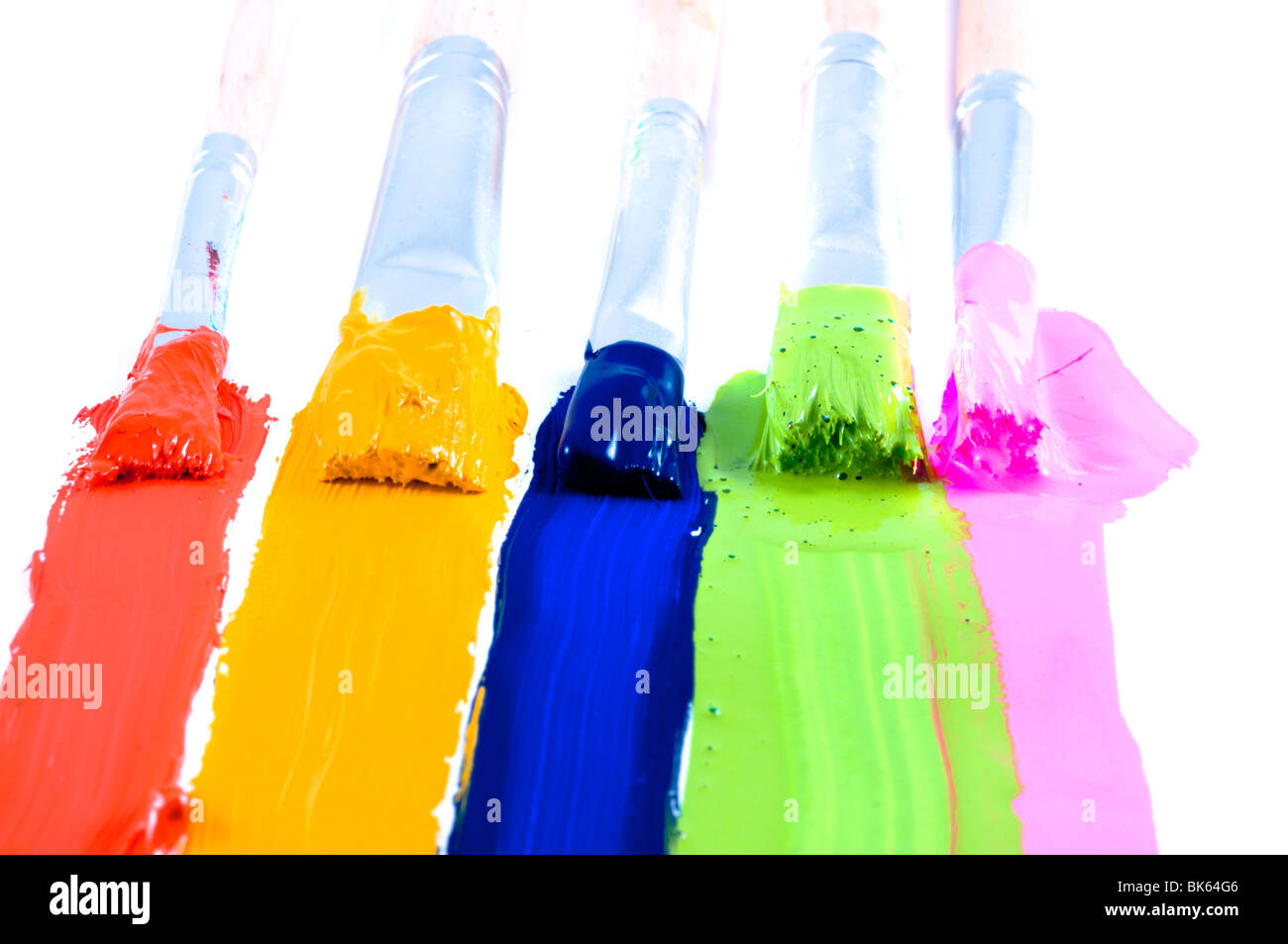 Brushes with paints. Isolation on white Stock Photo - Alamy