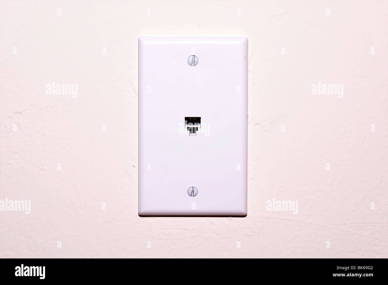 phone jack with white cover plate on textured wall Stock Photo - Alamy