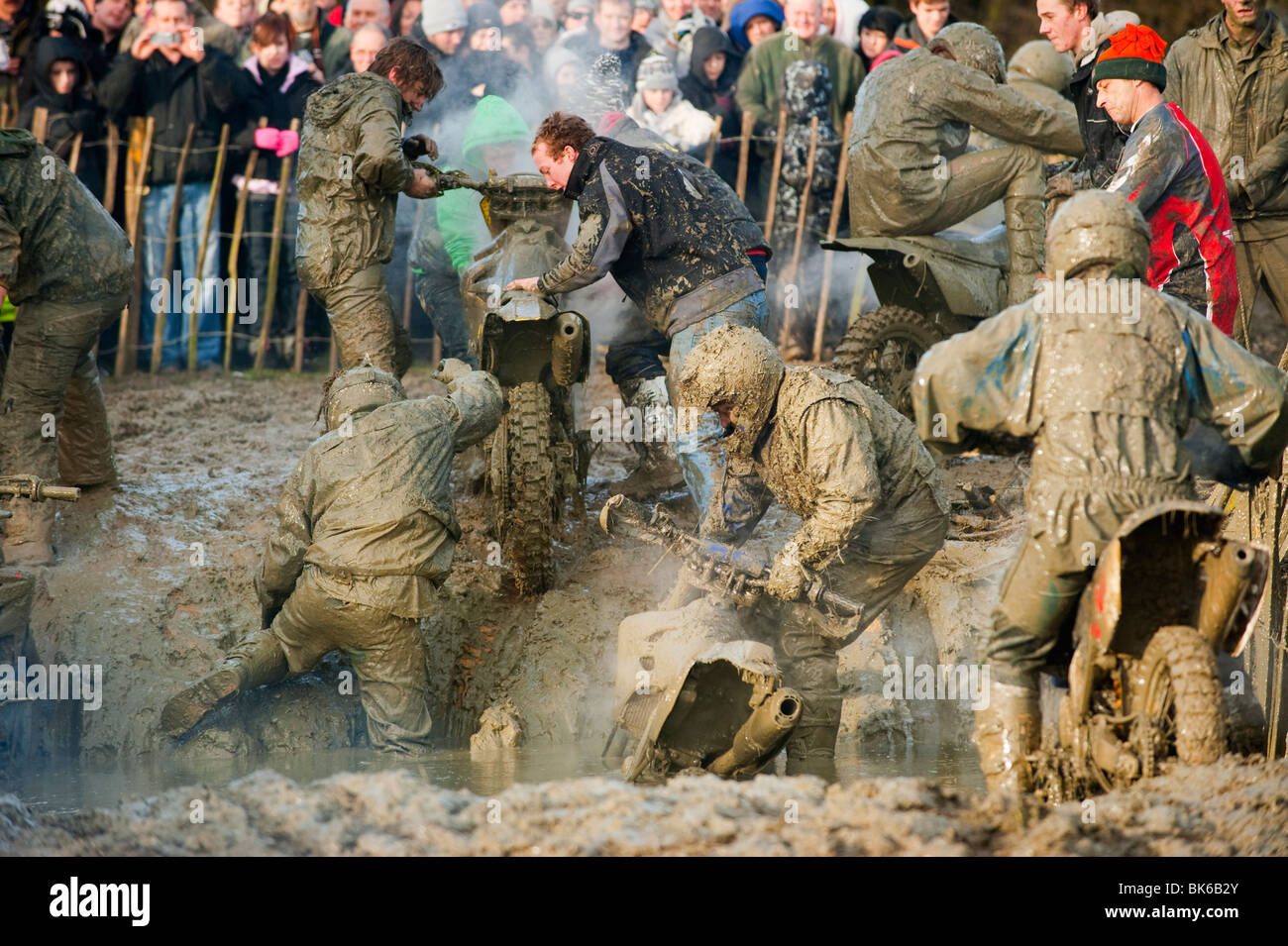 Motorbikes stuck in deep mud Stock Photo - Alamy