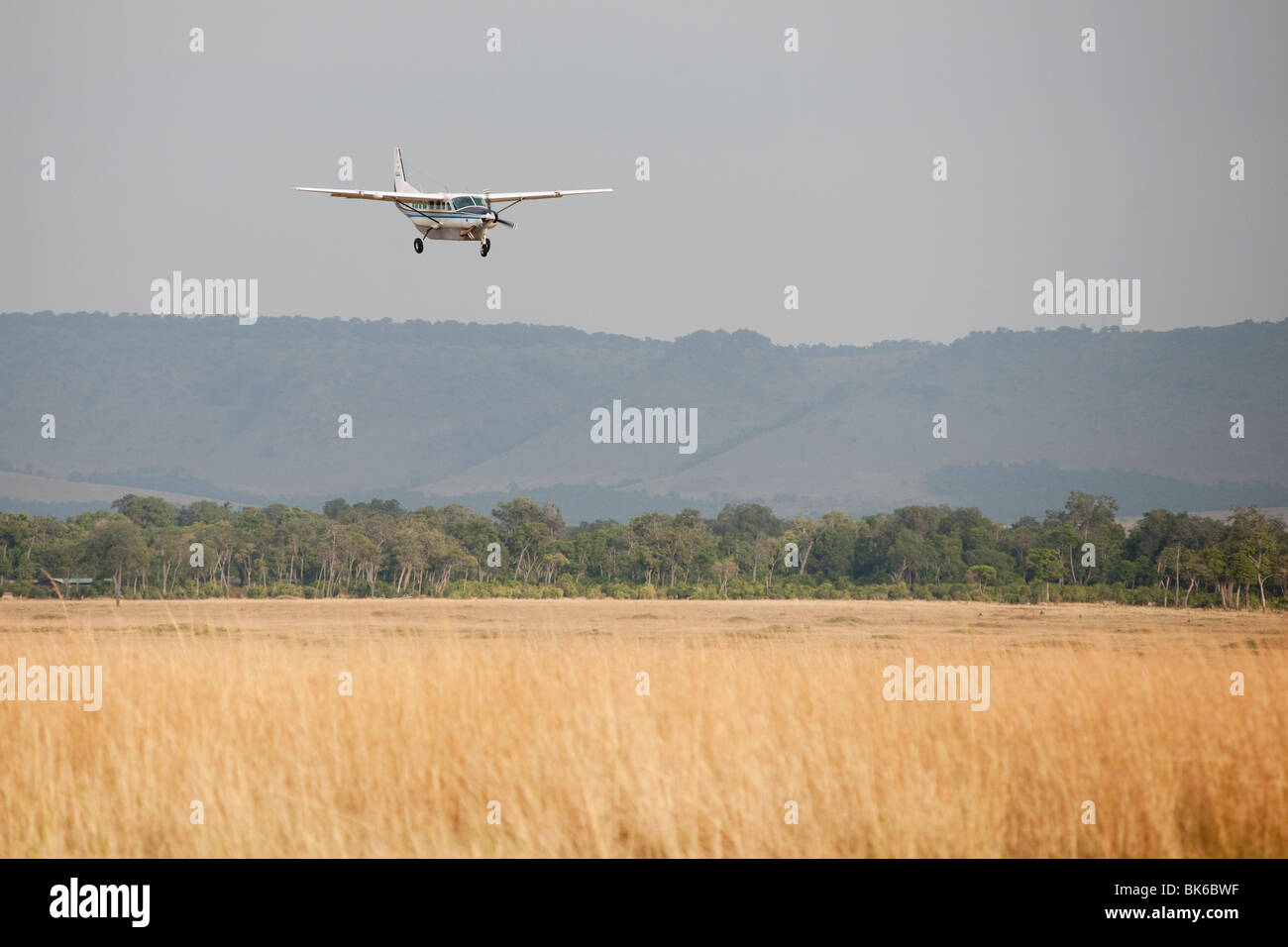 Airplane Over Field, Kenya, Africa Stock Photo - Alamy
