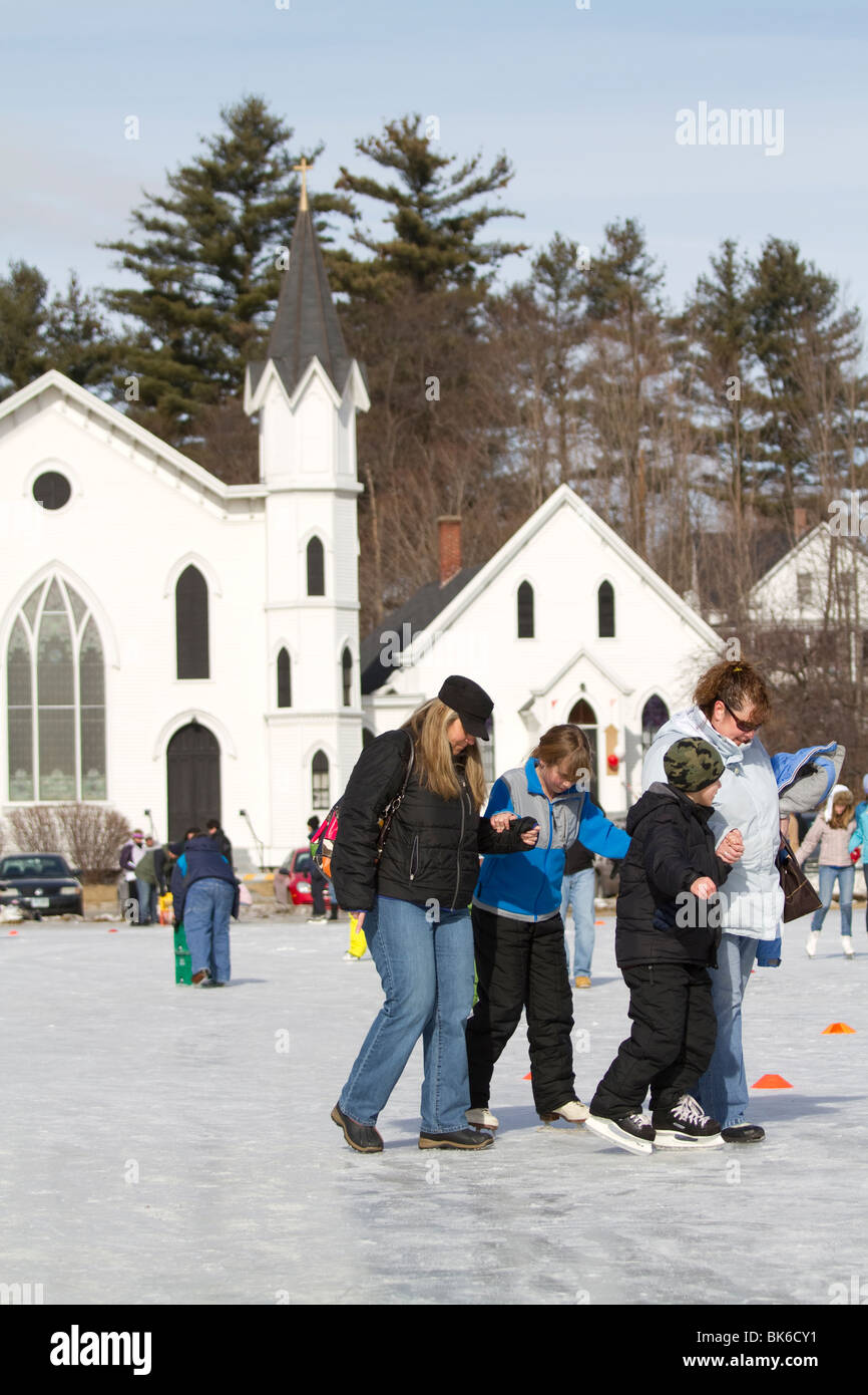 Family ice skates together on outdoor skating rink in winter Stock ...