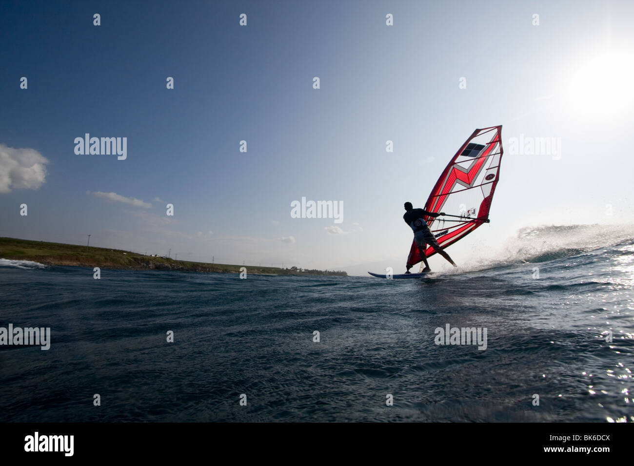 A windsurfer looks ahead on a wave at Ho'okipa Stock Photo - Alamy