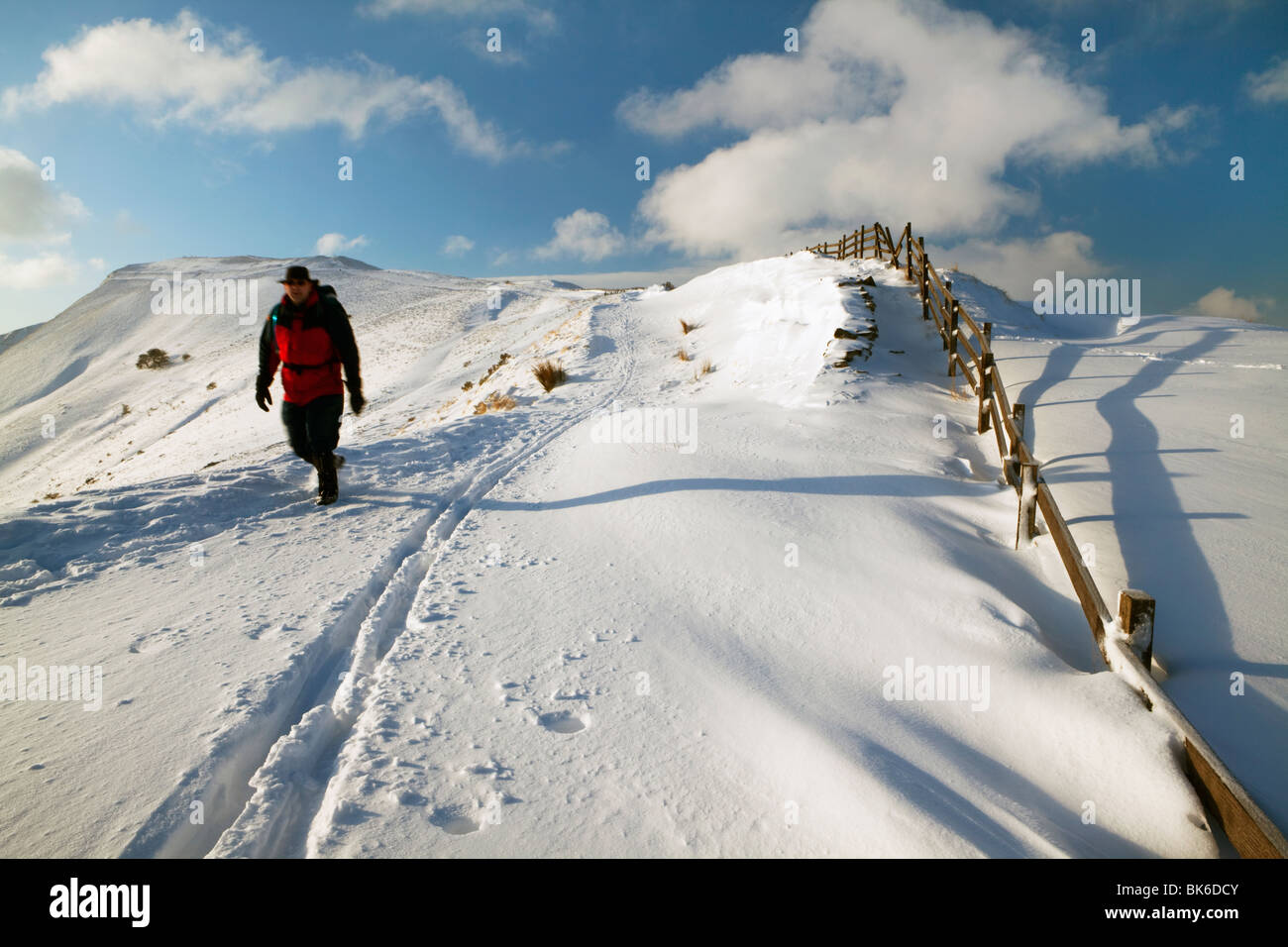 Walker in the snow, Mam Tor, Peak District National Park, UK, England ...