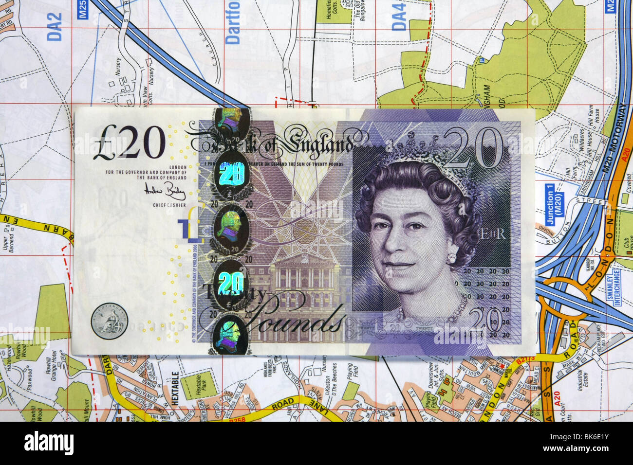 a £20 note on a the page of an open road map Stock Photo - Alamy