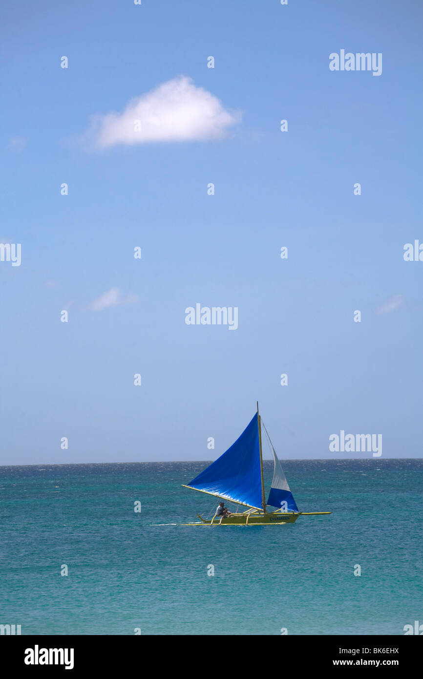 Single distant sailboat with a single cloud Stock Photo - Alamy