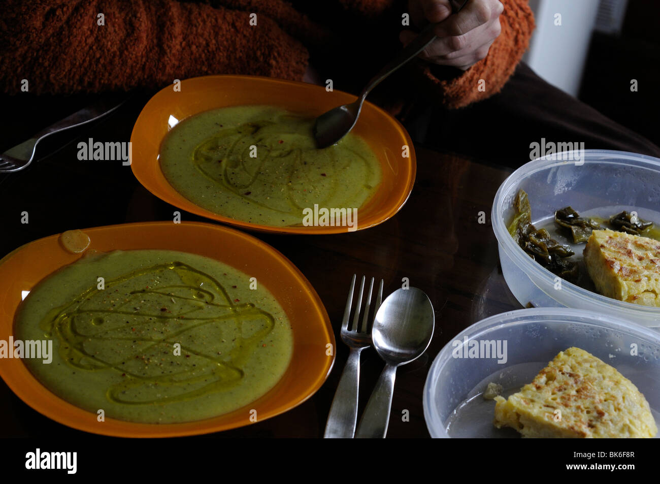 Pureed vegetables and Spanish omelet dishes on the table Stock Photo ...