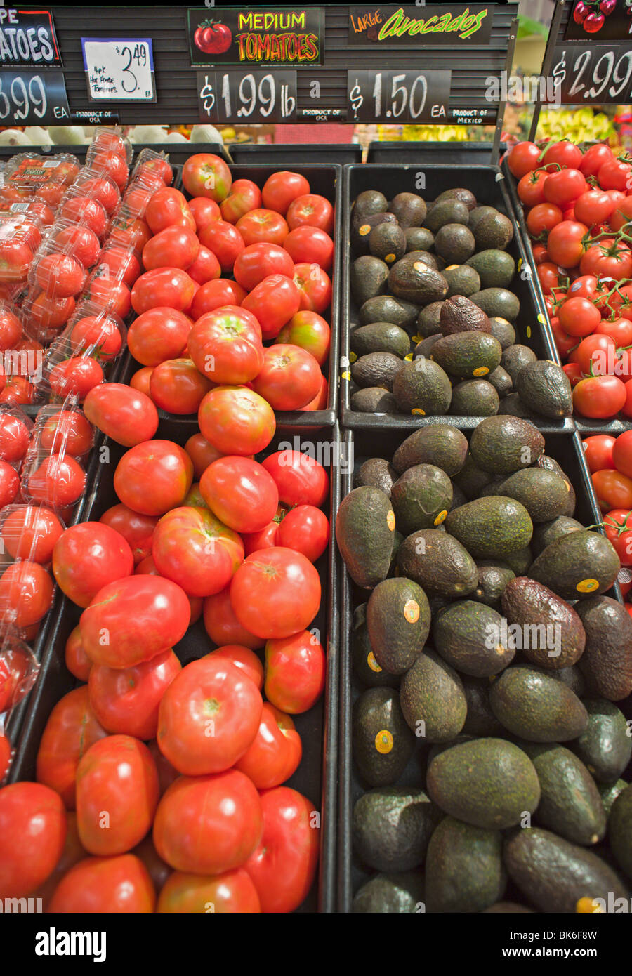 Inside of an American grocery store, displaying red ripe tomatoes and ...