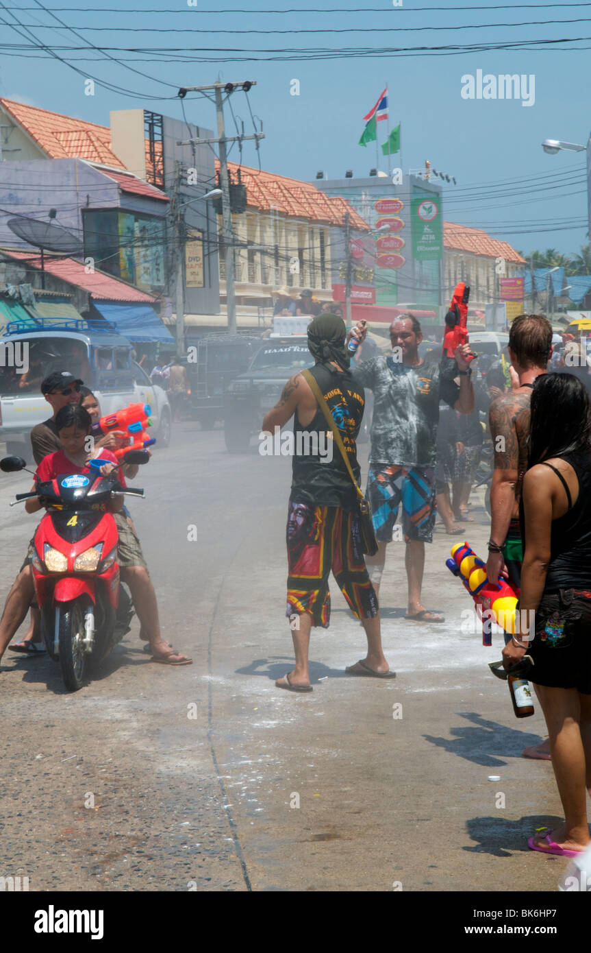 People shooting water and talcum powder at Songkran festival in Koh ...