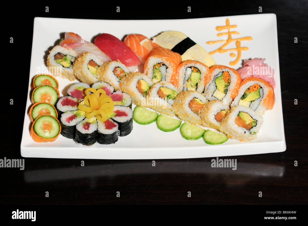 Assortment of Sushi on a platter including: Sushi Maki, futo maki ...