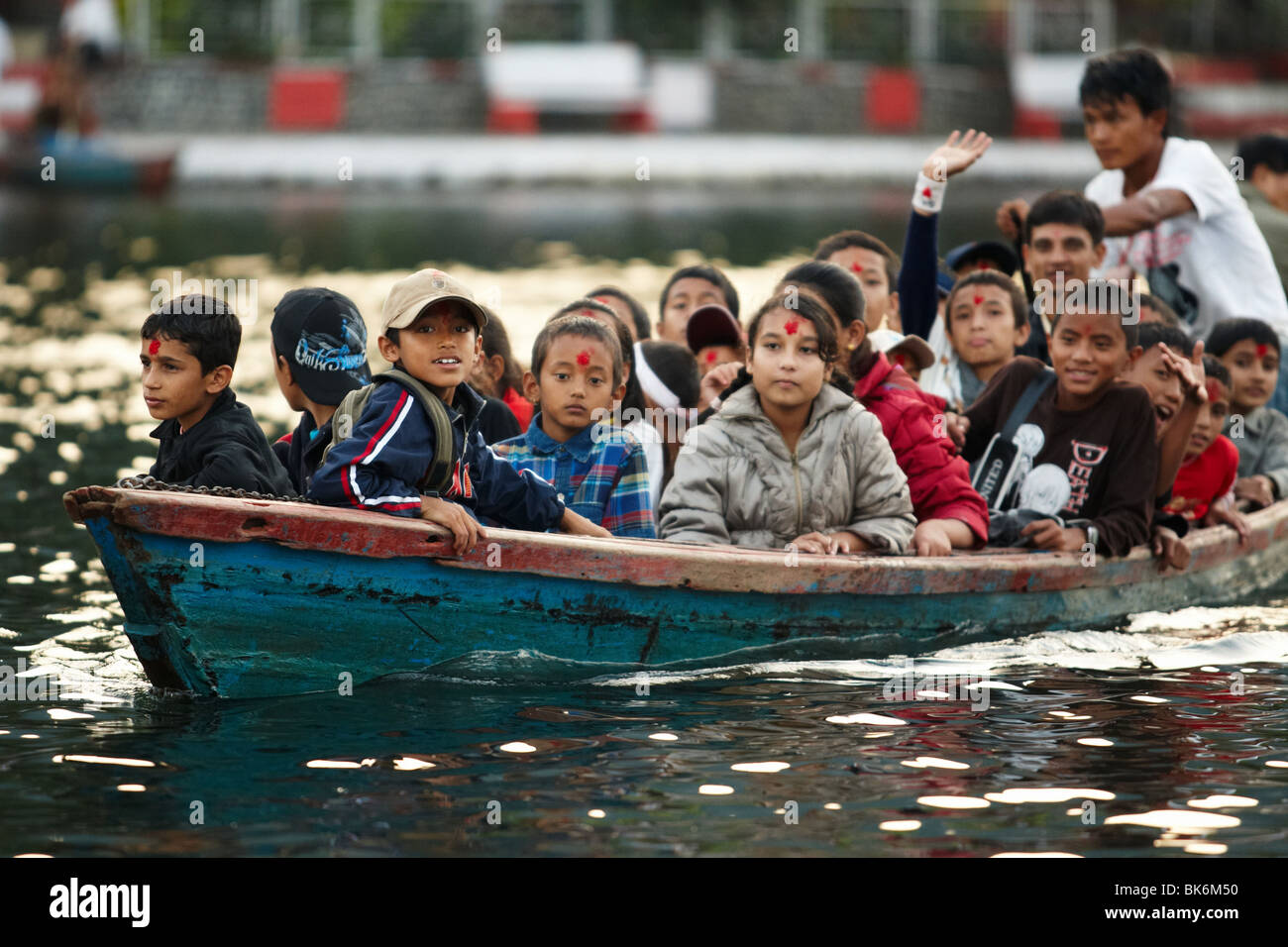 School children ride a canoe across Pewha Lake in Pokhara, Nepal on ...