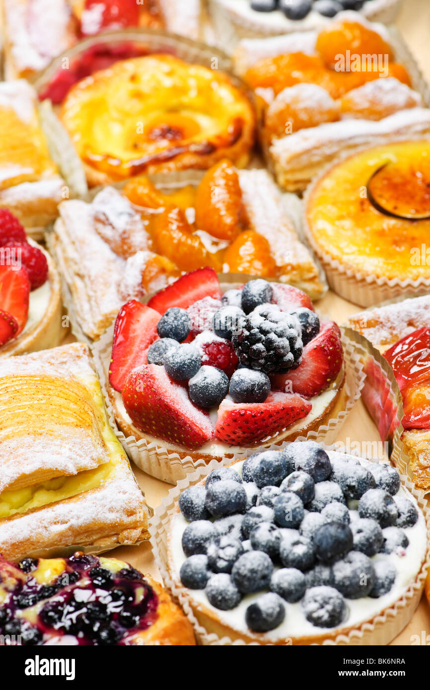 Background of assorted fresh sweet tarts and pastries Stock Photo - Alamy