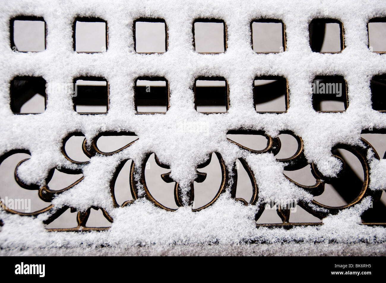 Snow accentuates the pattern of a metal design Stock Photo - Alamy
