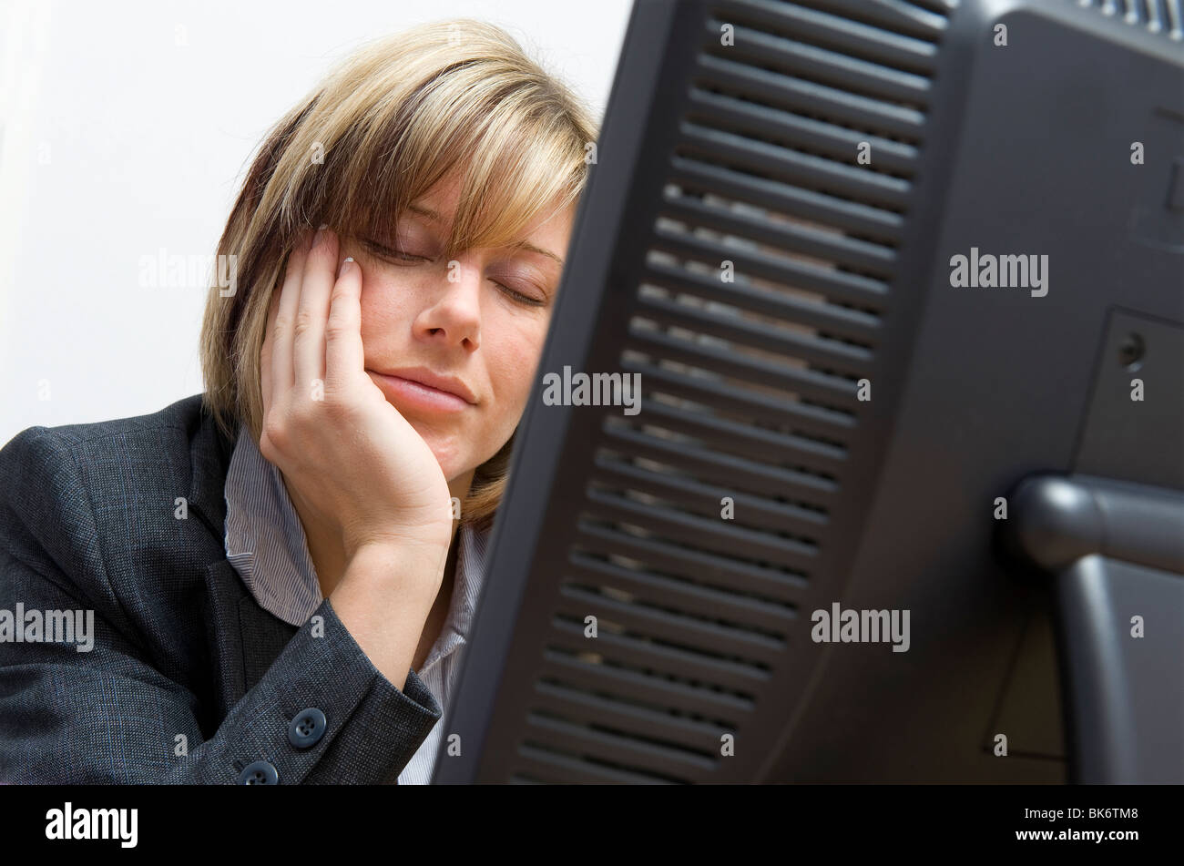 tired female office worker sleeping at desk Stock Photo - Alamy
