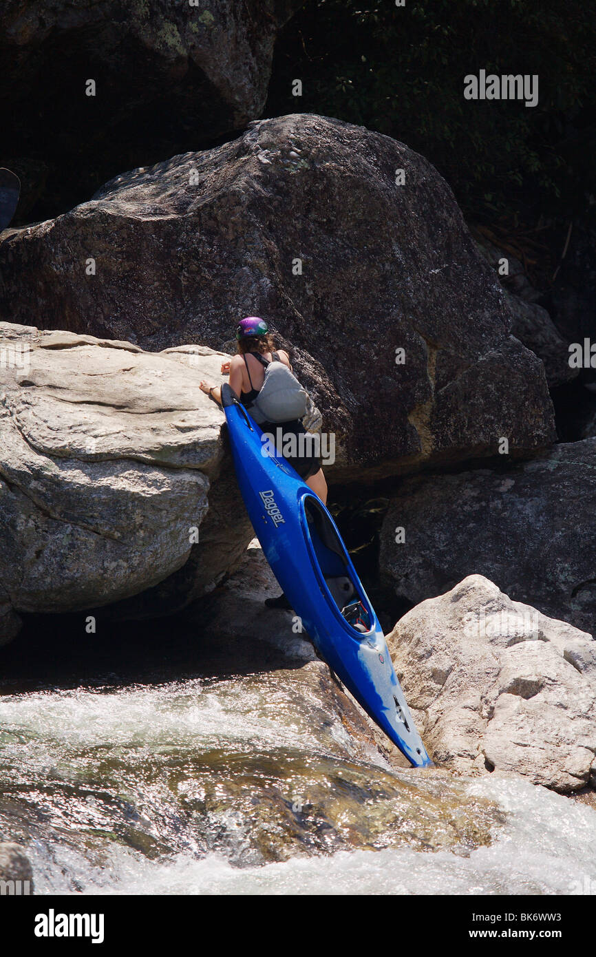 PORTAGE WOMAN CARRYING KAYAK AROUND RAPIDS BULL SLUICE CHATTOOGA RIVER ...