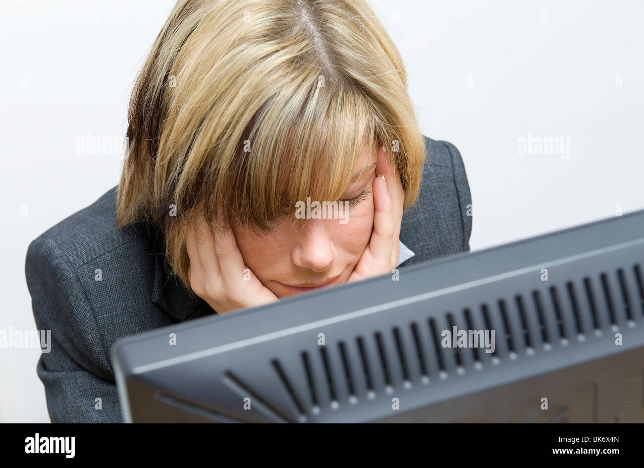 tired female office worker sleeping at desk Stock Photo - Alamy