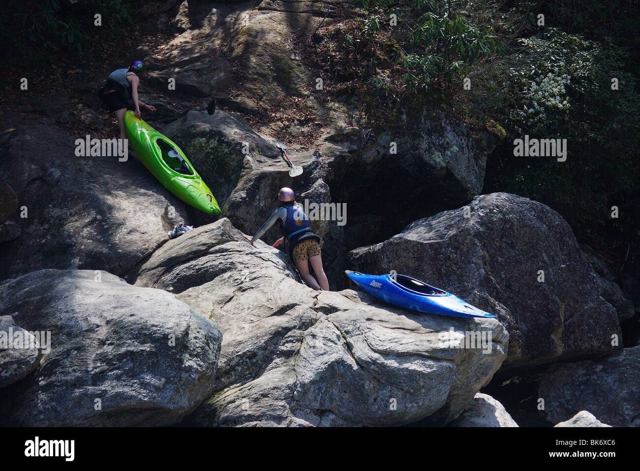 PORTAGE WOMAN CARRYING KAYAK AROUND RAPIDS BULL SLUICE CHATTOOGA RIVER ...