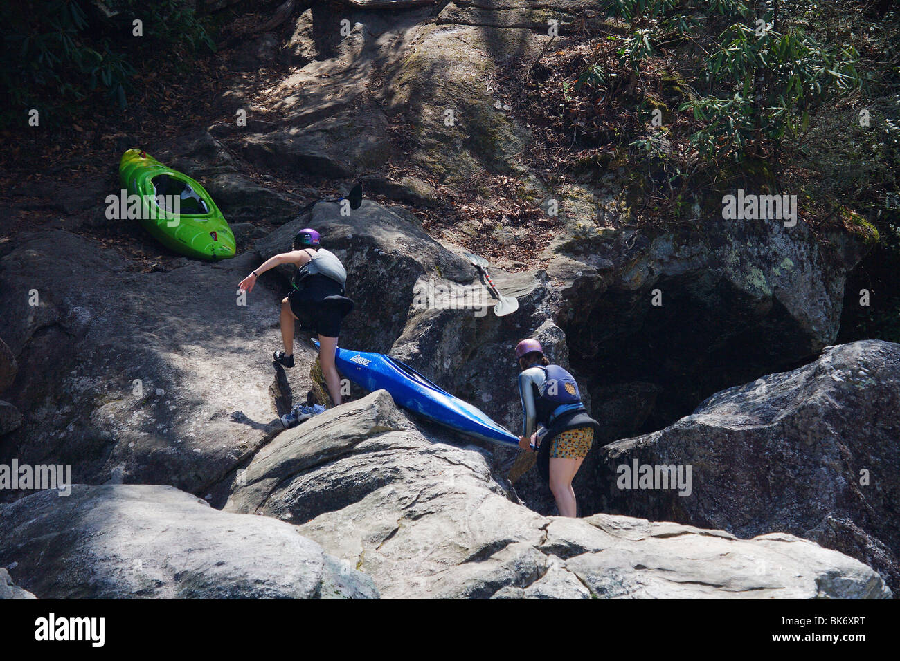 PORTAGE WOMAN CARRYING KAYAK AROUND RAPIDS BULL SLUICE CHATTOOGA RIVER ...