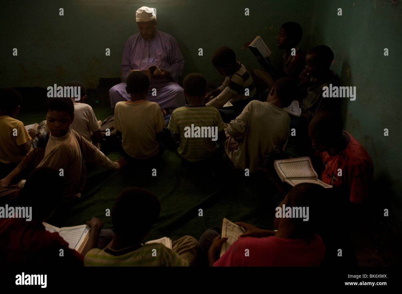 Children recite verses from the Quran in a madrasa in the town of Lamu ...