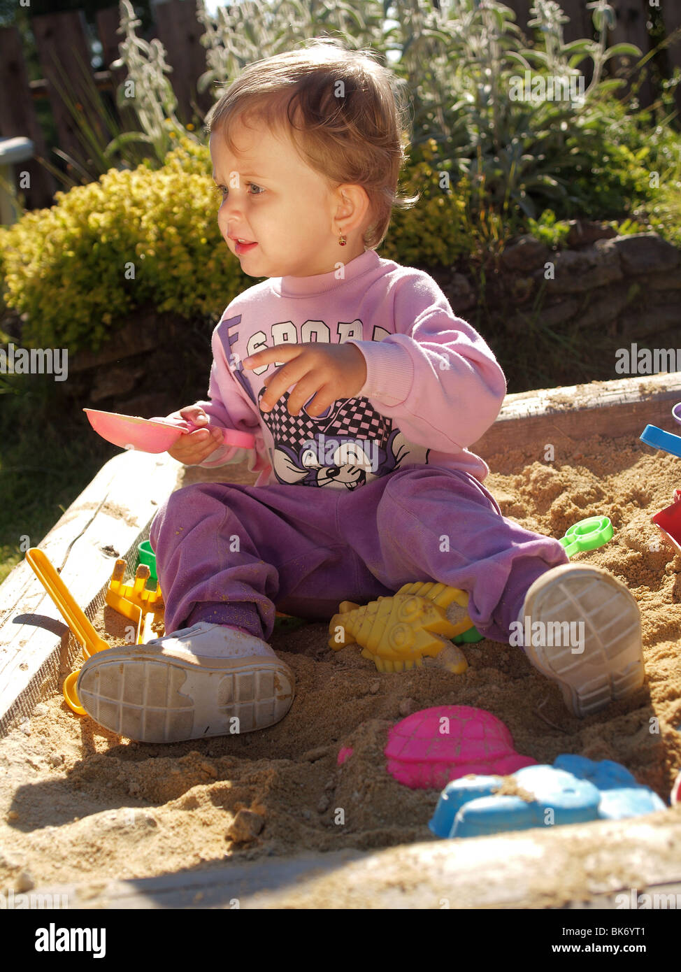 Child playing in the sand Stock Photo - Alamy