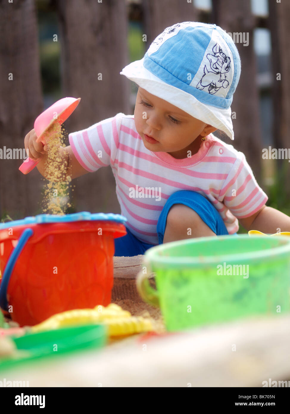 Child playing in the sand Stock Photo - Alamy