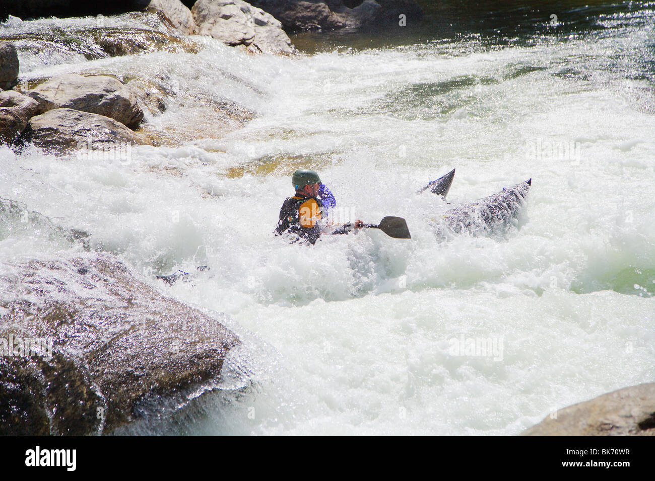 MAN AND WOMAN IN PONTOON RAFT BOAT CRASHING OVER RAPIDS BULL SLUICE ...