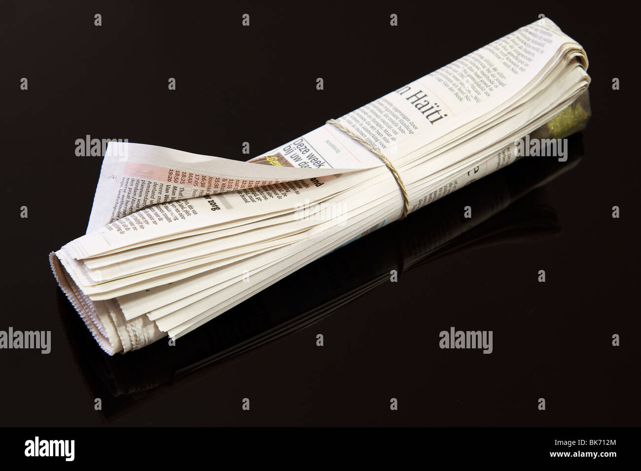 Rolled newspaper hi-res stock photography and images - Alamy