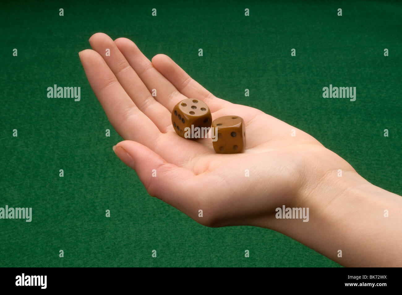 Hand with dice hi-res stock photography and images - Alamy