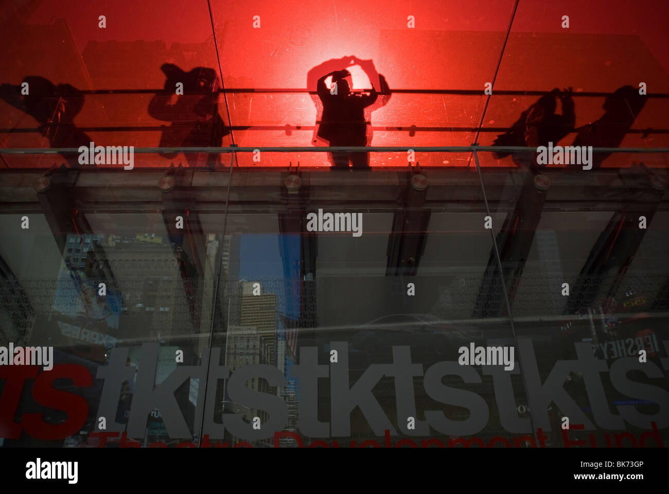Visitors atop the TKTS ticket booth in Times Square in New York on ...