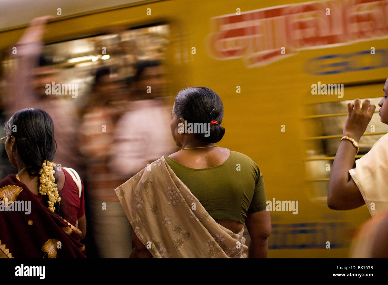 This is an image of Indian women waiting as a train moves by Stock ...
