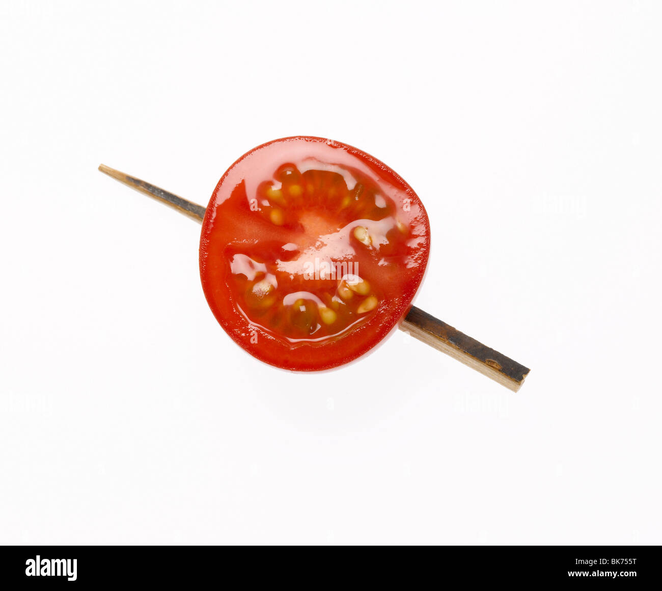 Single halved red tomato hi-res stock photography and images - Alamy