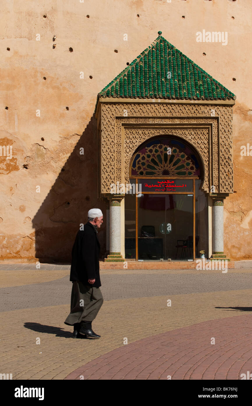 Moroccan man walking through Place el-Hedim, Meknes, Morocco Stock ...