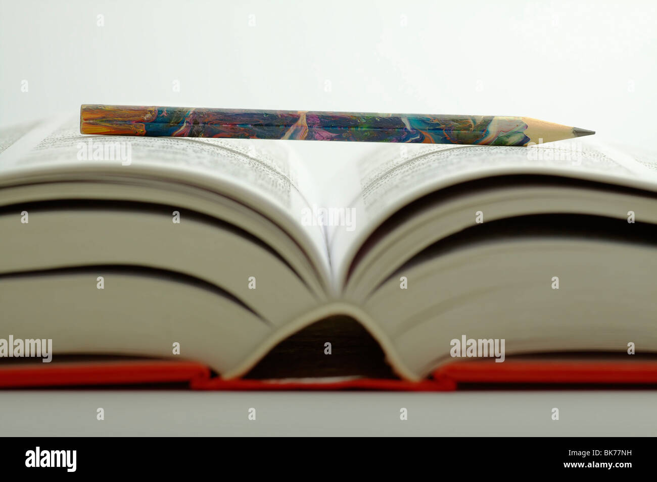 Pencil on the book Stock Photo - Alamy