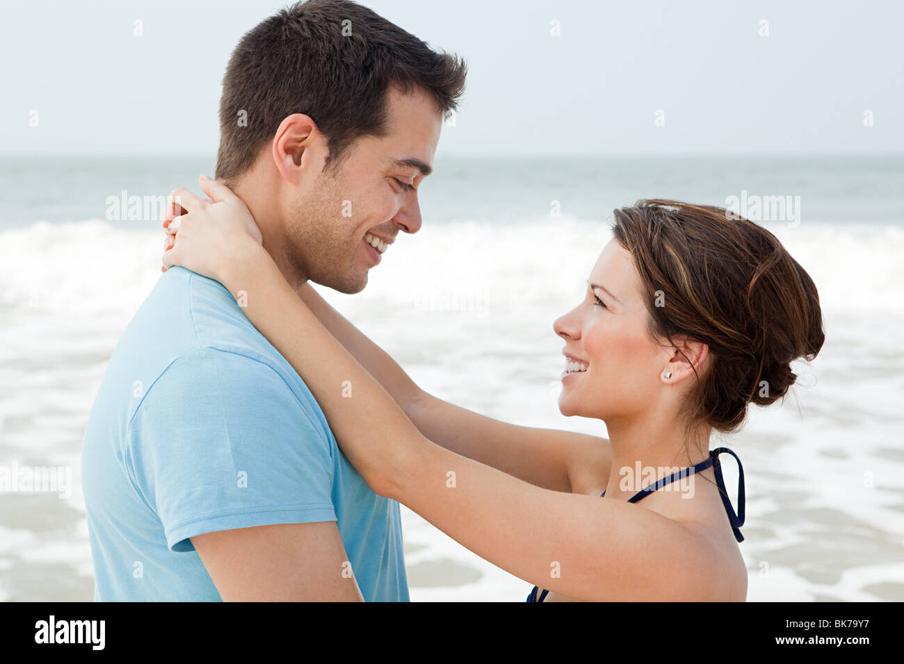 Couple by the ocean Stock Photo - Alamy