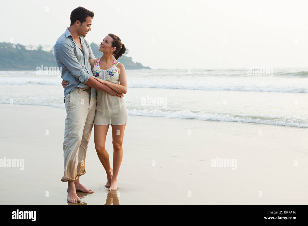 Couple by the ocean Stock Photo - Alamy