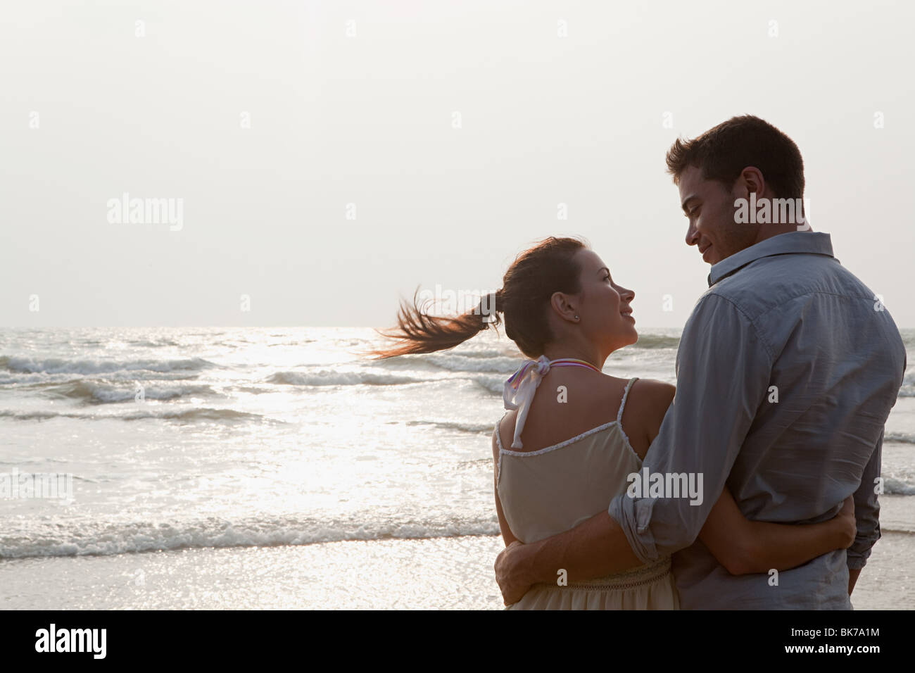 Couple by the ocean Stock Photo - Alamy