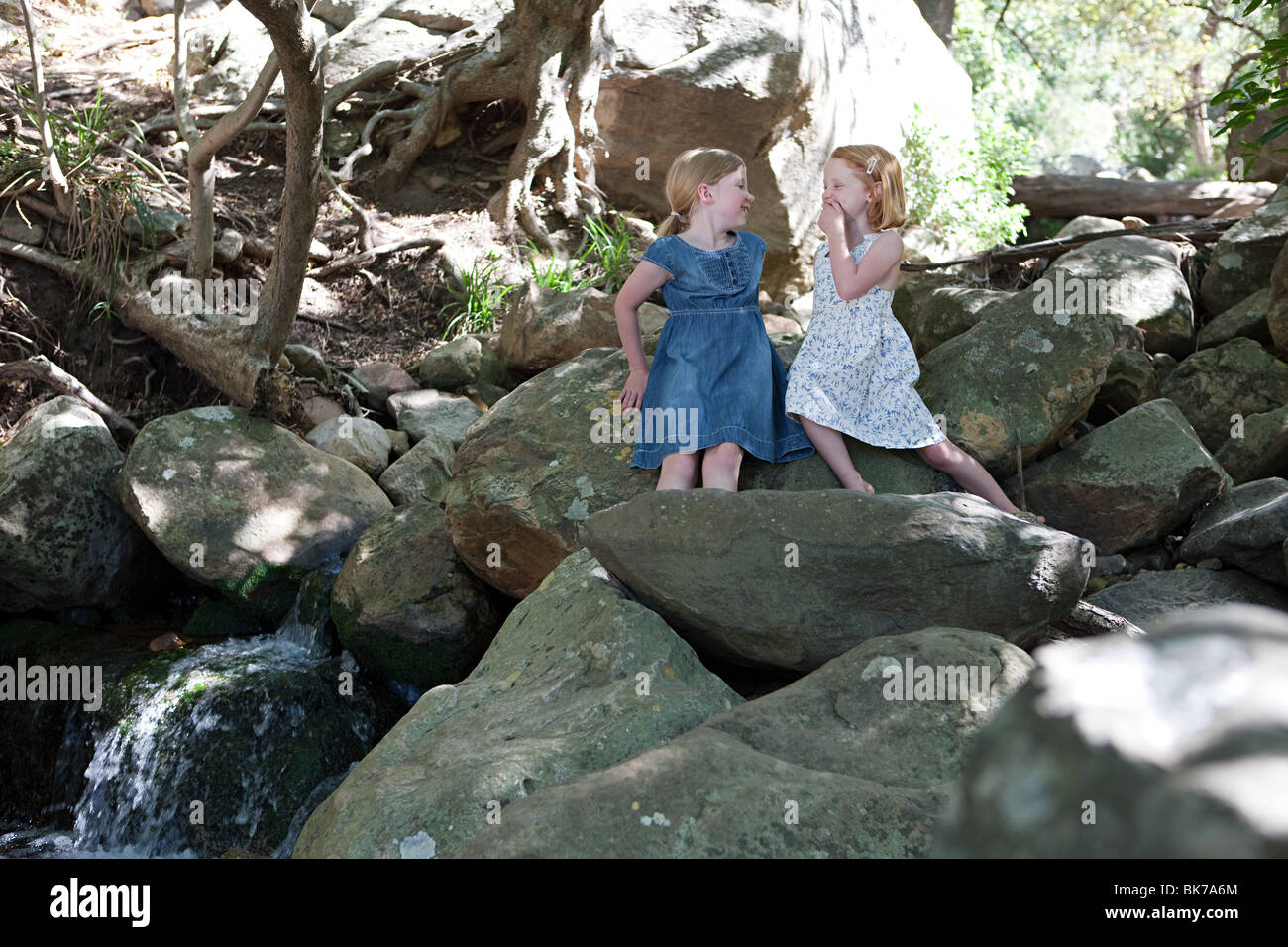 Girls playing on rocks hi-res stock photography and images - Alamy
