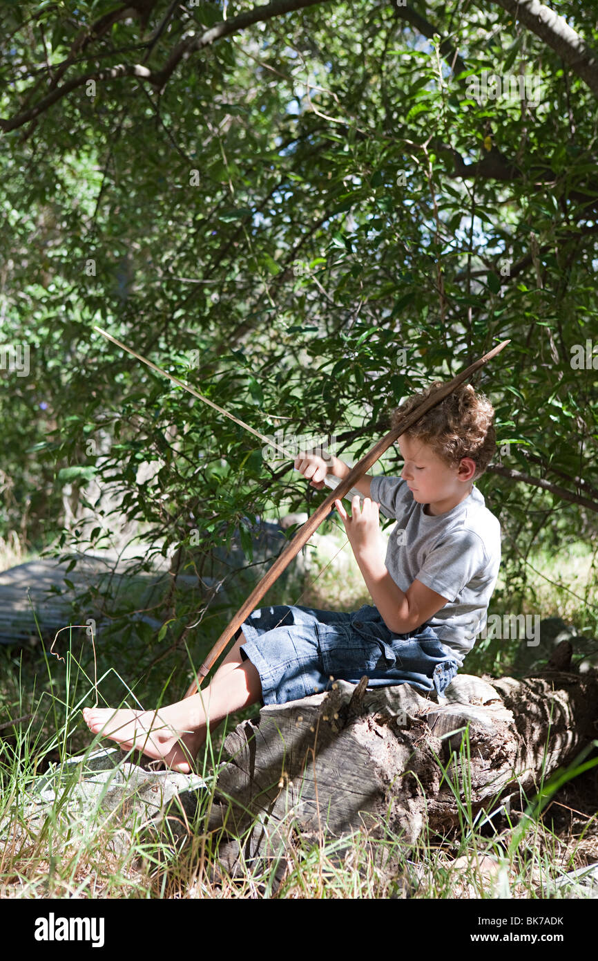 Boy with bow and arrow Stock Photo - Alamy