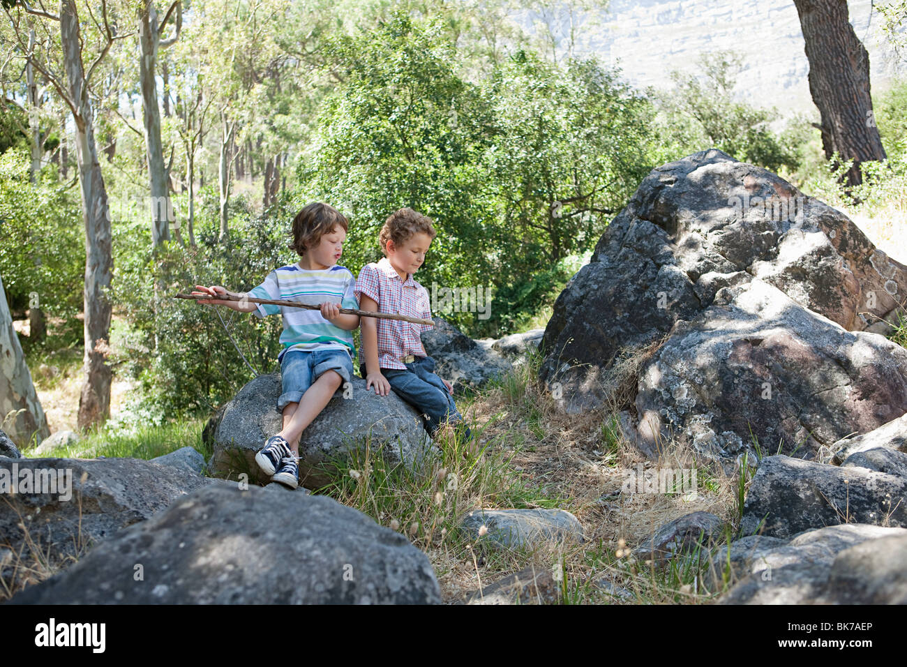 Two children playing on rocks hi-res stock photography and images - Alamy