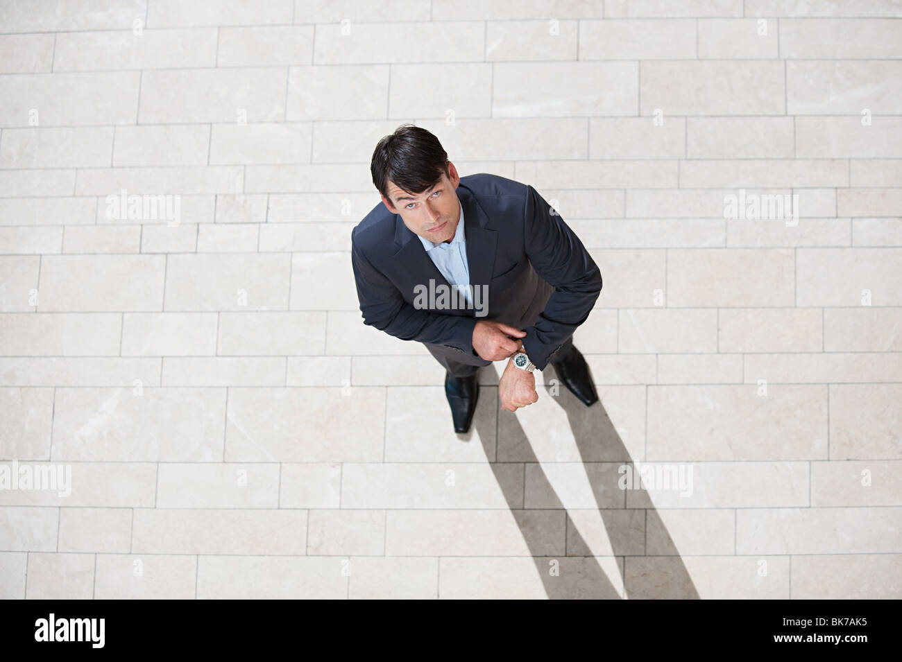 Businessman looking up Stock Photo - Alamy