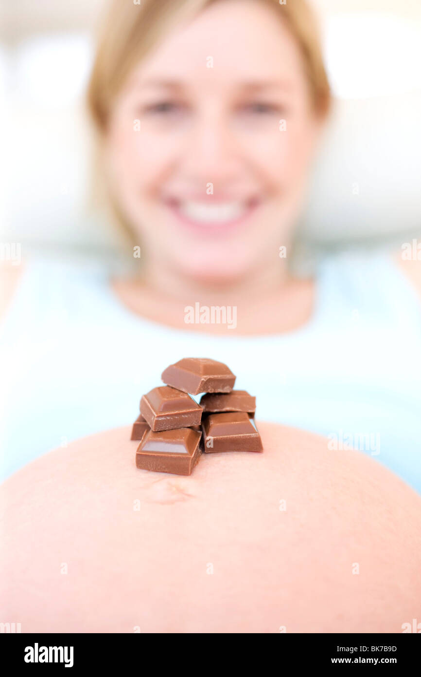 Chocolate on a pregnant woman's abdomen Stock Photo - Alamy