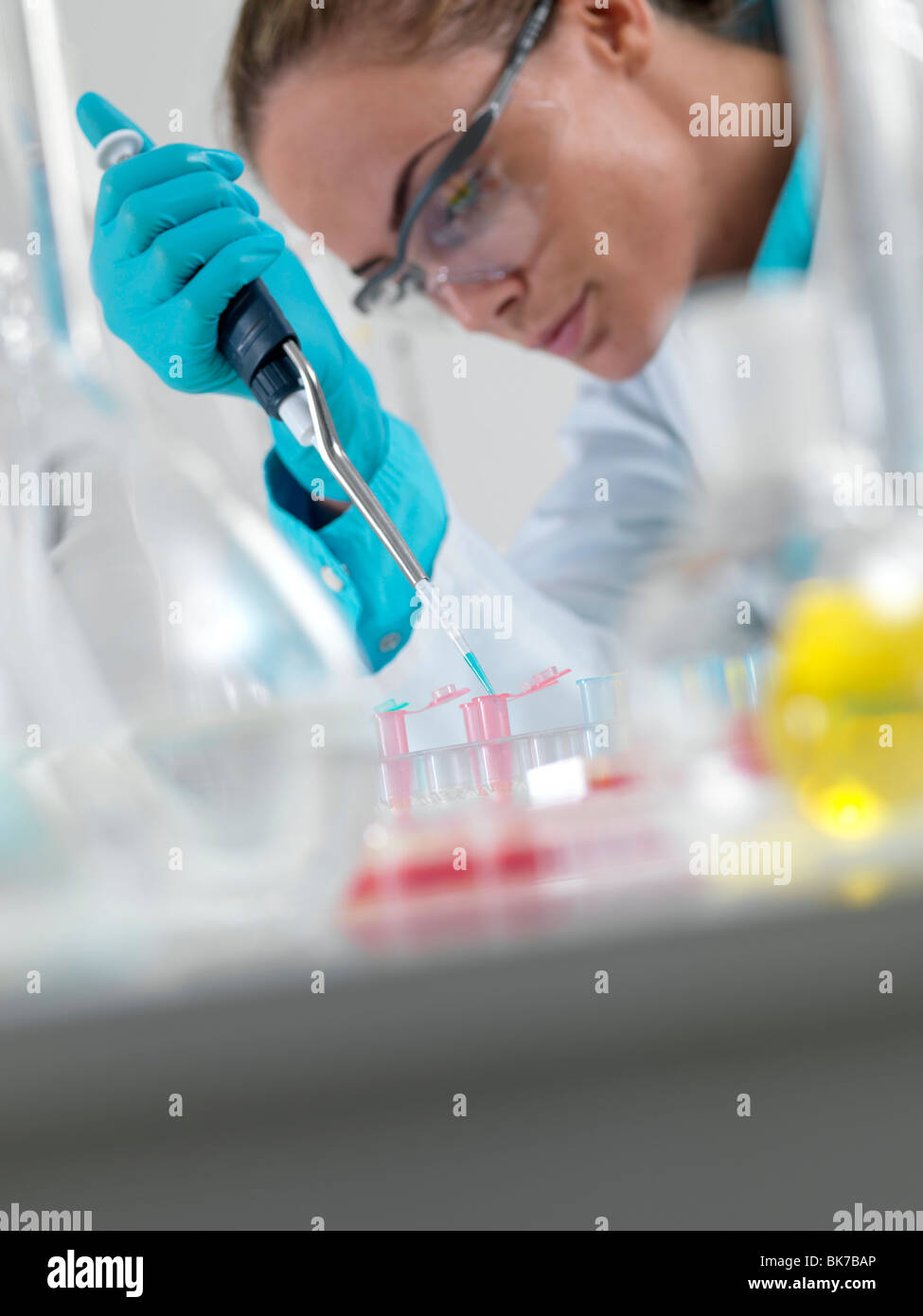 Researcher pipetting liquid Stock Photo - Alamy