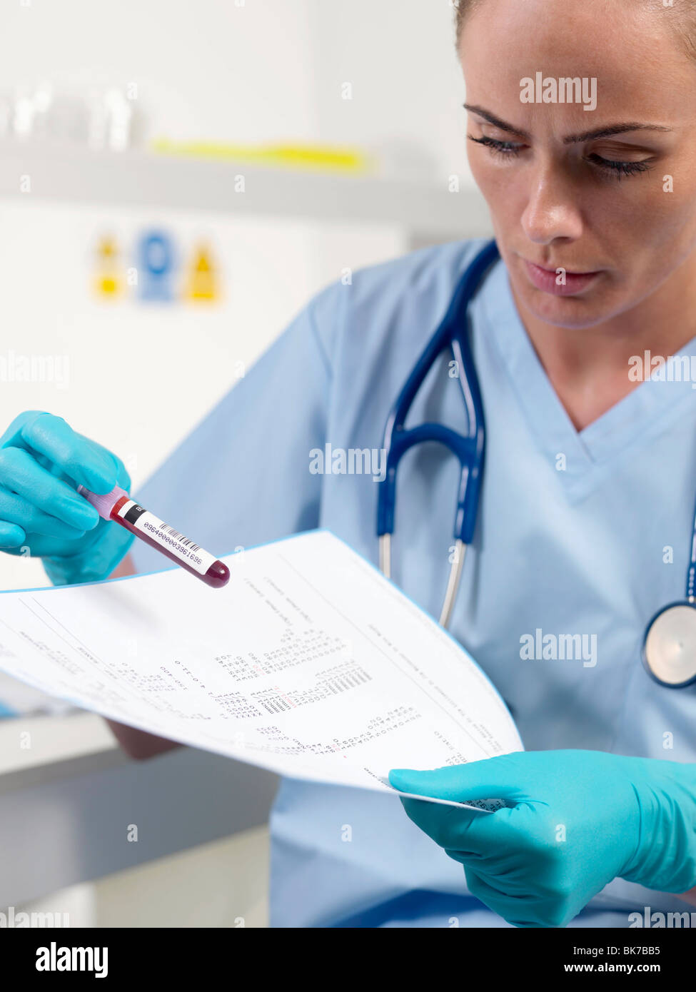 Doctor checking blood samples hi-res stock photography and images - Alamy